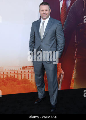 WESTWOOD, CA - AUGUST 20: Director Ric Roman Waugh (R) and wife Tanya ...