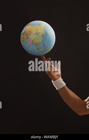 Image of globe spinning over world map Stock Photo - Alamy