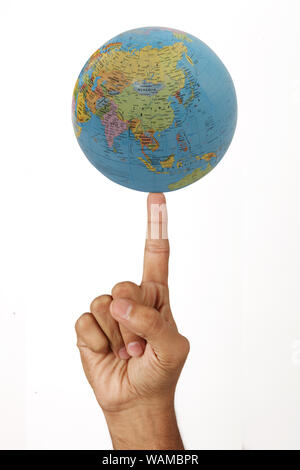 Image of globe spinning over world map Stock Photo - Alamy