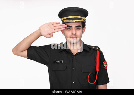 Young security guard saluting Indian flag Stock Photo - Alamy