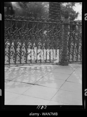 A wrought iron fence with Cornstalk Design Graces the metal gate of a ...