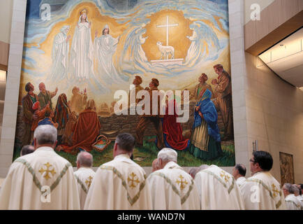 Apparitions of Mary, Joseph and John the Evangelist appear on the wall ...