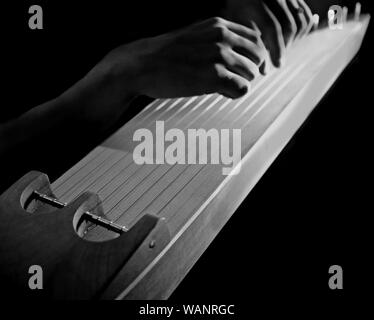 Playing the traditional Finnish instrument kantele Stock Photo - Alamy