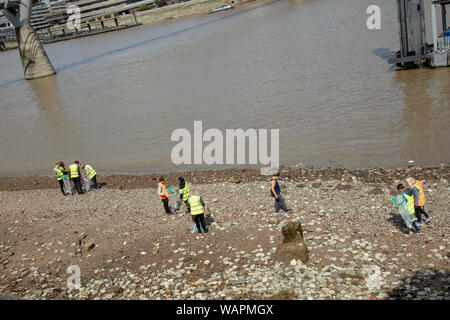 Volunteer clean up of the river Thames in London. Plastic pollution in ...