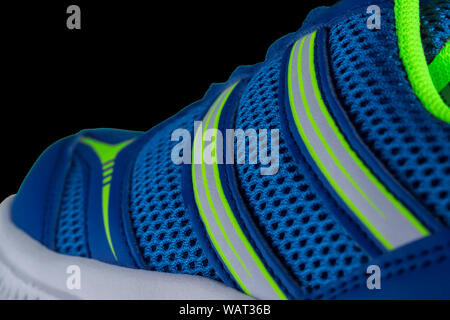 Fragment of green sneaker fabric. The texture of the material of sports ...
