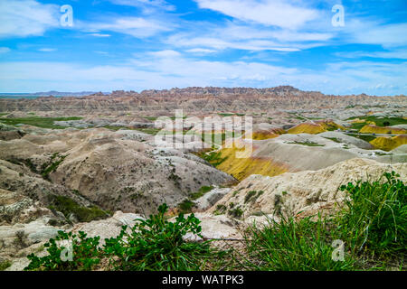Badlands National Park, SD, USA - June 1, 2008: Green landscape with ...