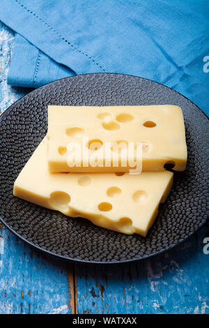 Two blocks of French emmental semi-hard cheese close up Stock Photo - Alamy