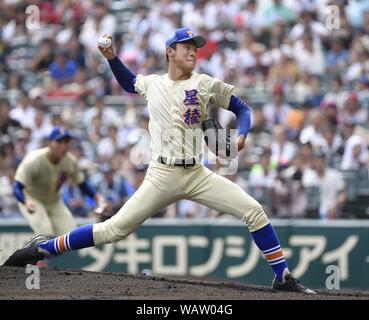 Yasunobu Okugawa of Seiryo High School pitches against Riseisha High ...