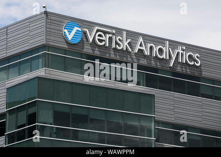 A logo sign outside of the headquarters of Verisk Analytics in Lehi ...
