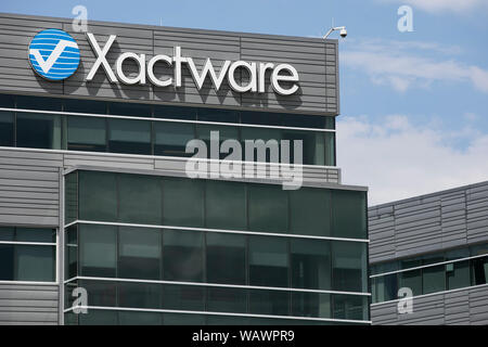 A logo sign outside of the headquarters of Xactware in Lehi, Utah on ...