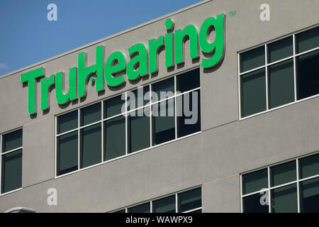 A logo sign outside of the headquarters of TruHearing in Draper, Utah ...