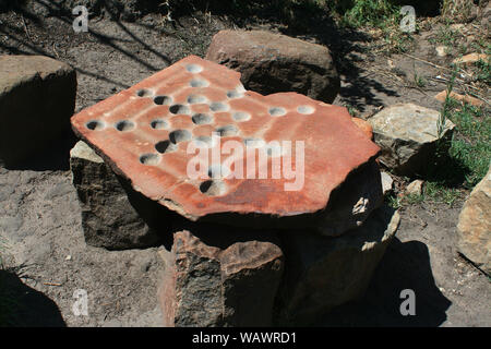Morabaraba game carved in stone, Basotho Cultural Village, Free State ...