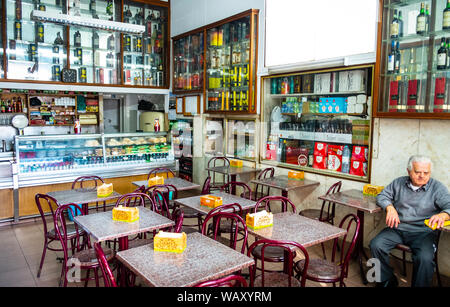 Tables and chairs in a quiet cafe during the day Stock Photo - Alamy