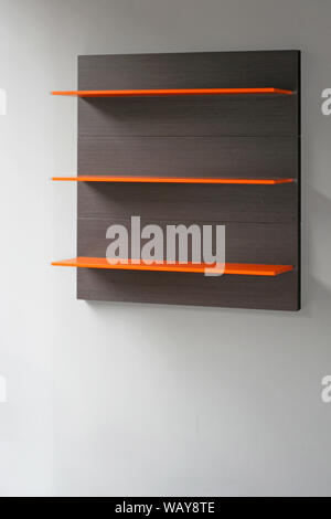 Empty shelf on orange wall. Background template scene. Horizontal ...