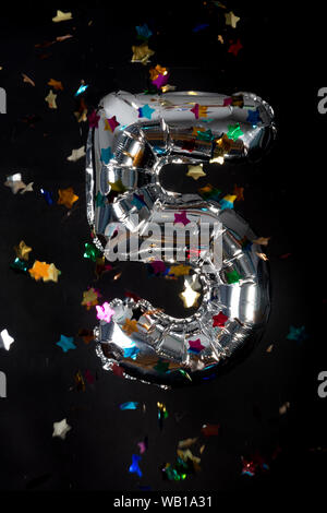 Silver falling confetti on metallic backdrop. Festive and party concept ...