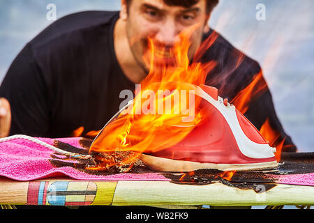 An accident with an ironing iron for clothes, device overheated and ...