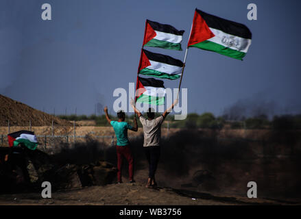 Protesters hold flags during the demonstration. A demonstration through ...
