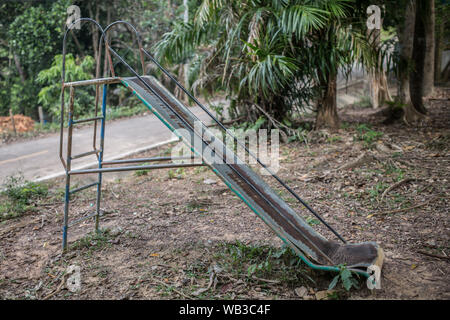 Abandoned and rusty playground themed photo Stock Photo - Alamy