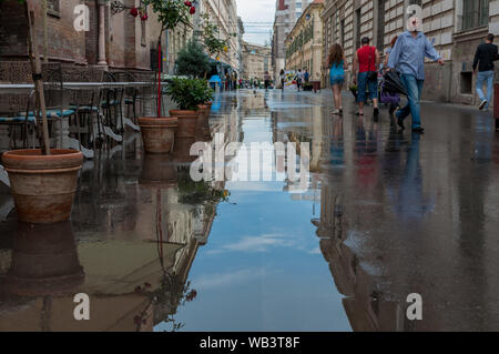 TIMISOARA, ROMANIA - JULY 23, 2014: People walking on the street. After ...