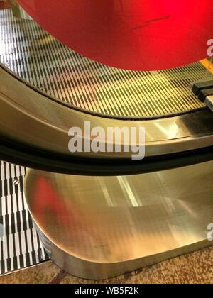 Image of attractive man in striped t-shirt smiling and holding gray ...