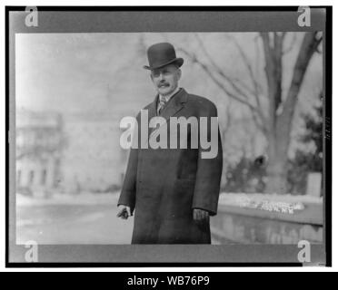 A half-length portrait of Edward Thomas Taylor, shown standing outdoors ...