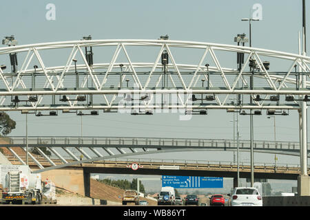 cars and vehicles speed along the N1 highway toll road with a blue sign ...