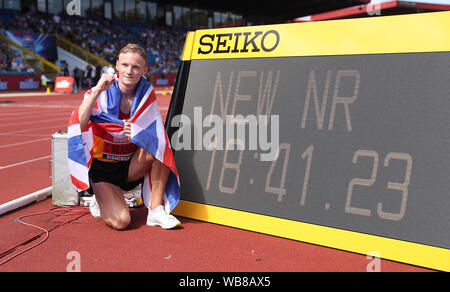 Callum Wilkinson celebrates his victory in the 5000 metres race walk ...