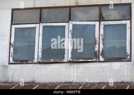 Dirty windows - old, dirty, glass window panes covered in cobwebs ...