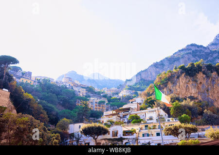 Italian flag with Positano town in Tyrrhenian sea, Amalfi coast, Italy ...