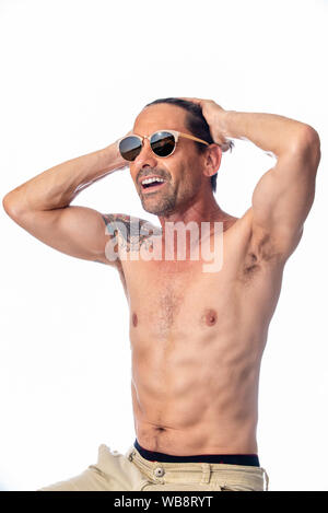 Middle age aviator man wearing vintage helmet and glasses holding paper ...