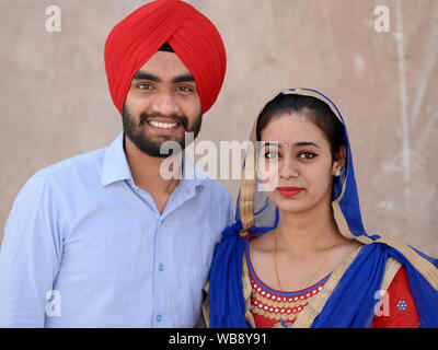 Sikh couple posing in traditional attire Stock Photo - Alamy