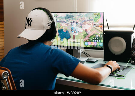 Person playing fortnite video game on computer Stock Photo - Alamy