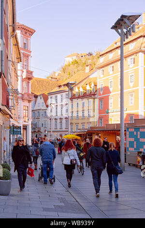 Graz, Austria - February 16, 2019: People at street cafes and ...