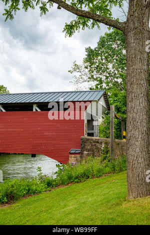 . The Red Bridge . Iron truss bridge, covered with red priming paint ...
