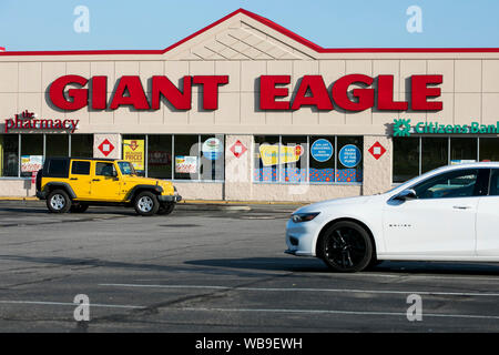 A logo sign outside of a Giant Eagle grocery store in Frederick ...