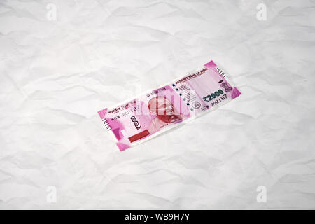 Modern Indian Two Thousand Rupees Currency Note on a minimal pink ...