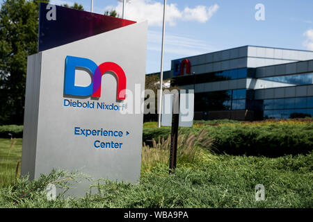 A logo sign outside of the headquarters of Diebold Nixdorf in North ...