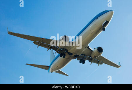 New passenger plane departing from runway in airport in afternoon Stock ...