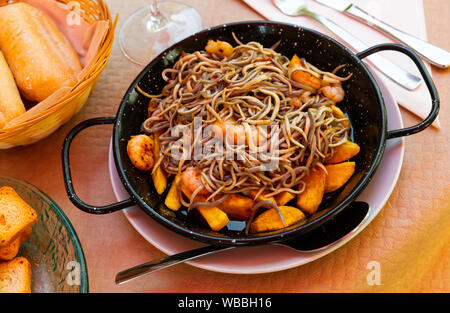 Elvers roasted with shrimps Stock Photo - Alamy