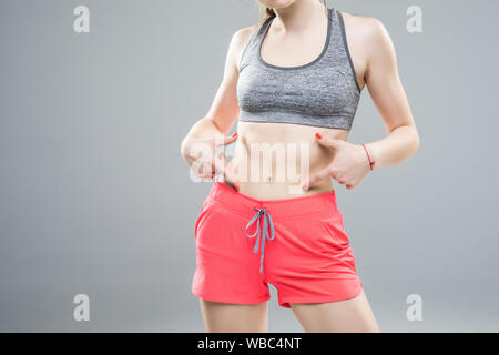Close up of young woman's torso. Perfect abdomen muscles of a female ...