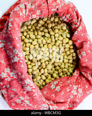 Soybeans in cloth bag isolated on white background with clipping path ...