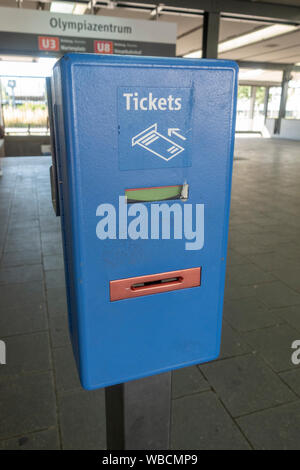 Germany, Bavaria, Munich, Person at ticket machine in subway station ...