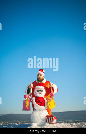 Winter holidays and shopping concept. Surprised and confused guy ...