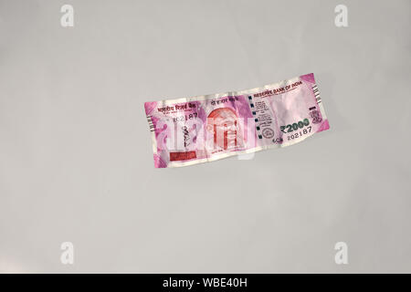 wrinkled modern Indian Two Thousand Rupees Currency Note on a minimal ...