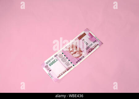 Modern Indian Two Thousand Rupees Currency Note on a minimal pink ...