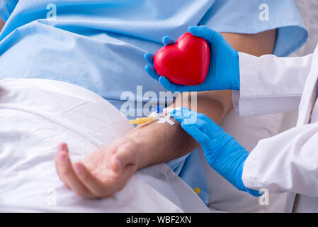 The male patient getting blood transfusion in hospital clinic Stock ...