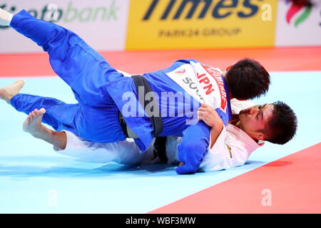 Abe Hifumi of Japan, top, and Joshiro Maruyama of Japan compete during their men's -66kg final ...