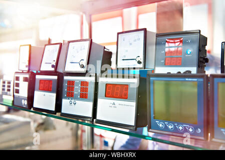 Digital and analog devices for measuring electricity in store Stock ...