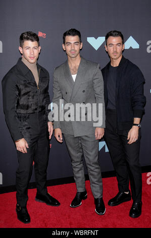 (L-R) Kevin Jonas, Nick Jonas and Joe Jonas attend Disney+'s "A Very ...