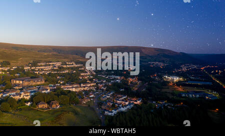 countryside landscape at night in summer. forested hills and grassy ...